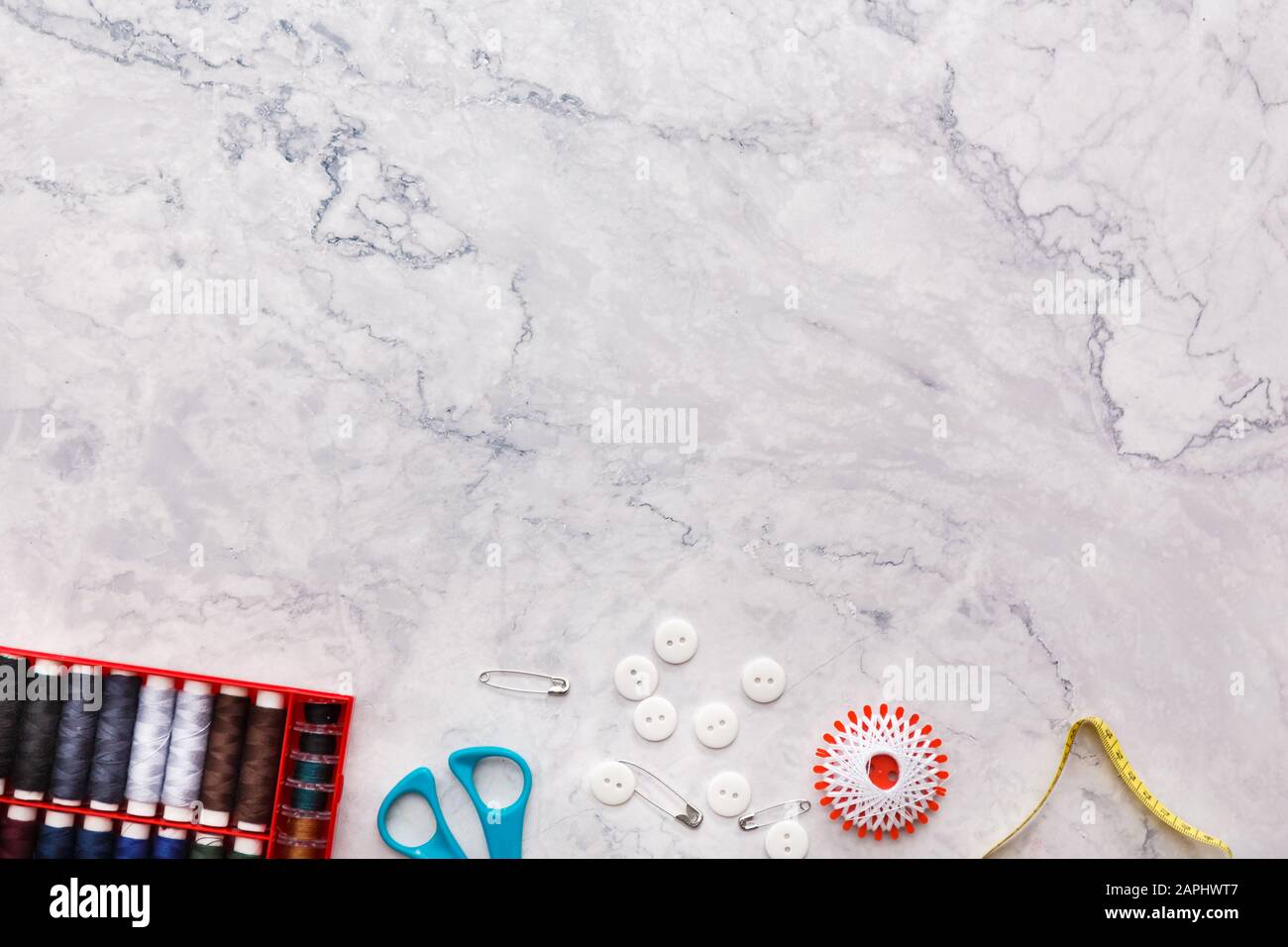 colorful sewing and tailoring tools and items on light background Stock ...