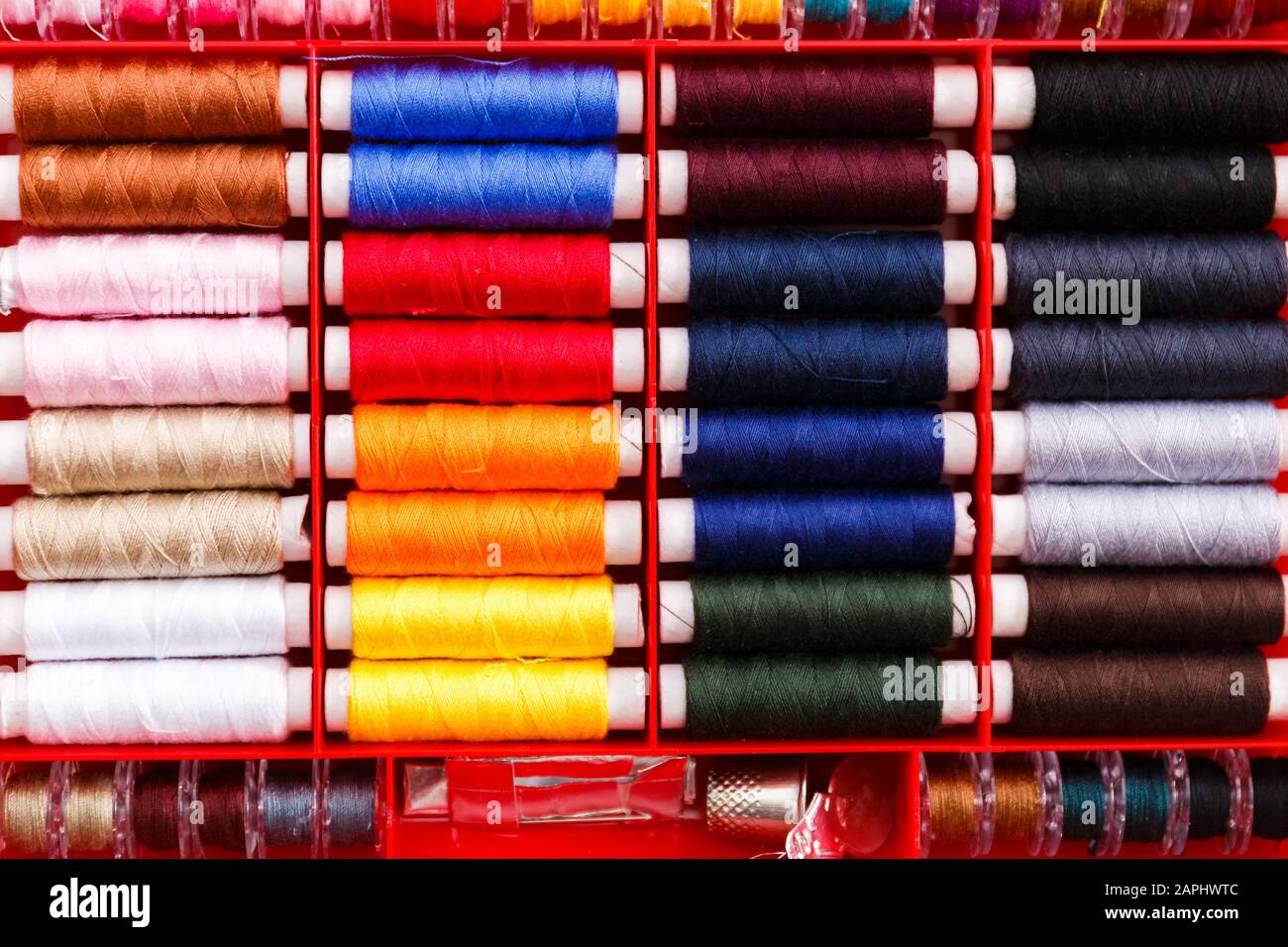 colorful sewing and tailoring tools and items on light background Stock ...