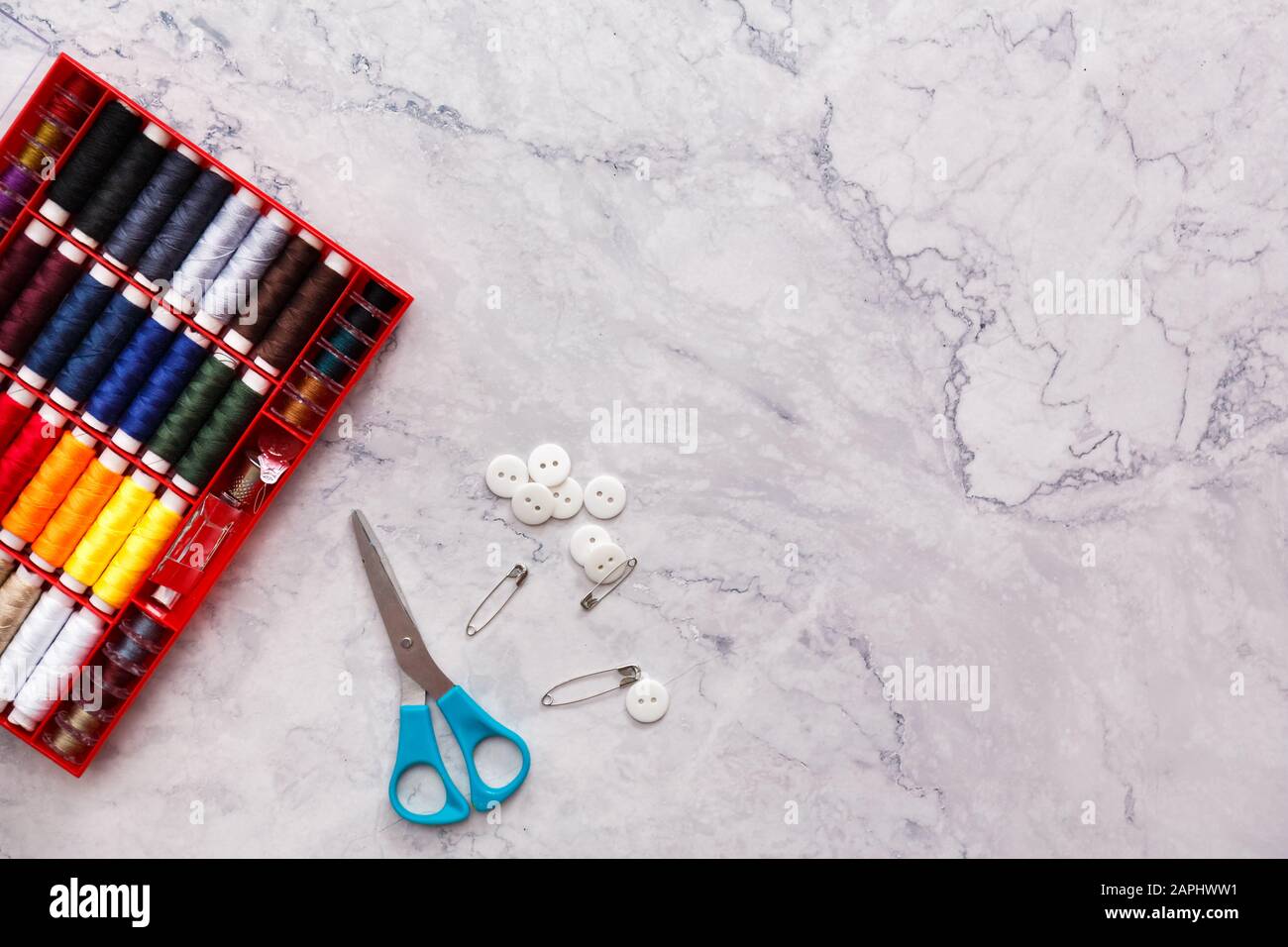 colorful sewing and tailoring tools and items on light background Stock ...