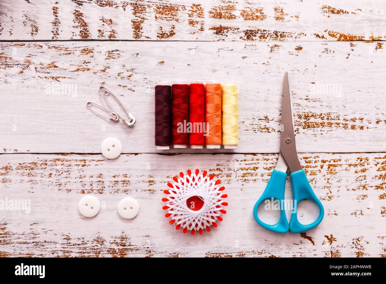 colorful sewing and tailoring tools and items on light background Stock ...