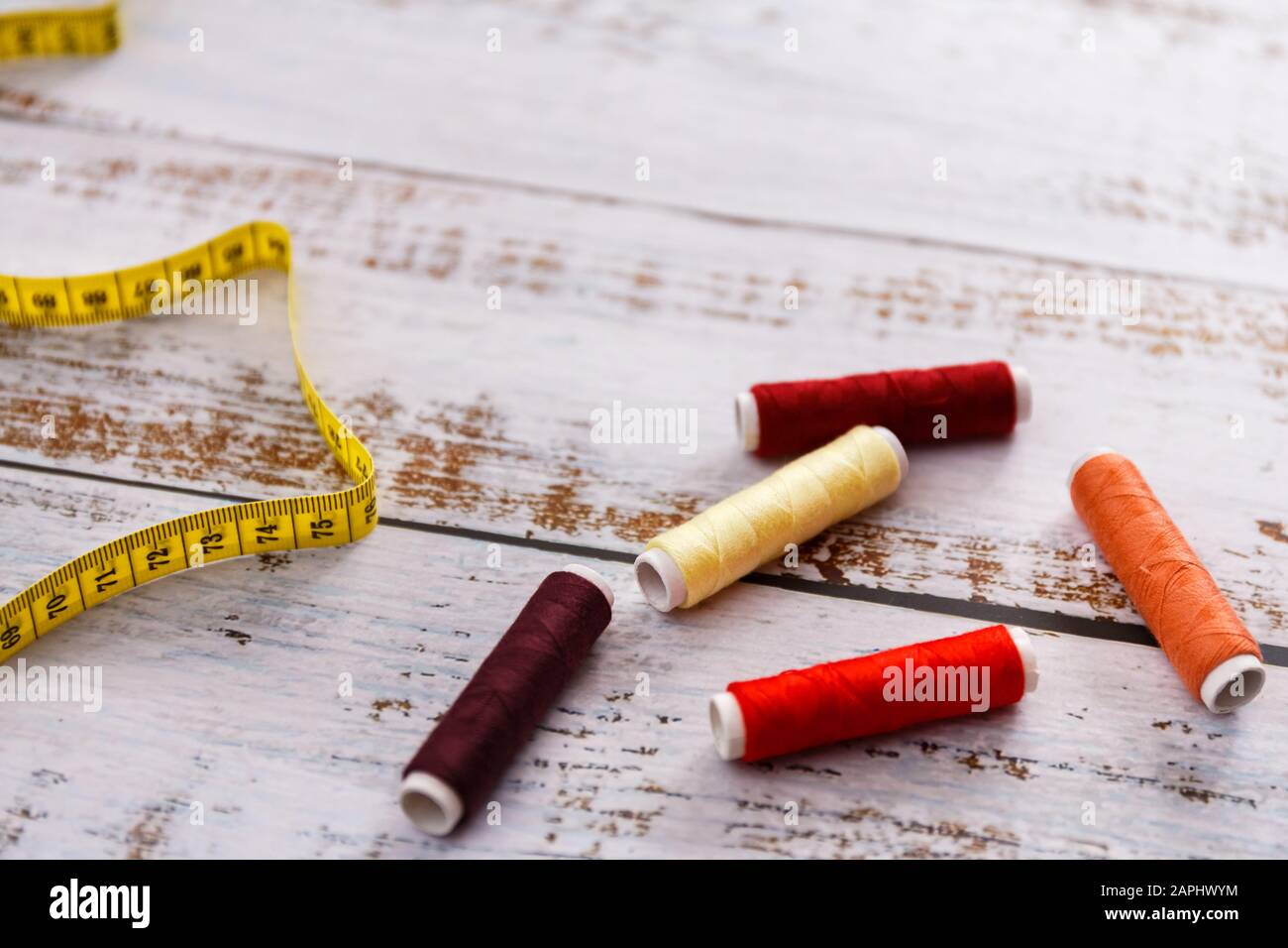 colorful sewing and tailoring tools and items on light background Stock ...