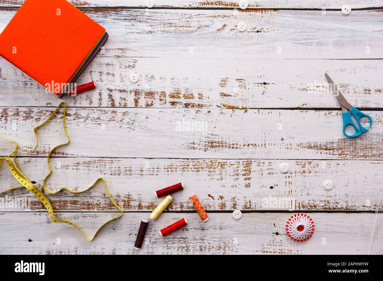 colorful sewing and tailoring tools and items on light background Stock ...