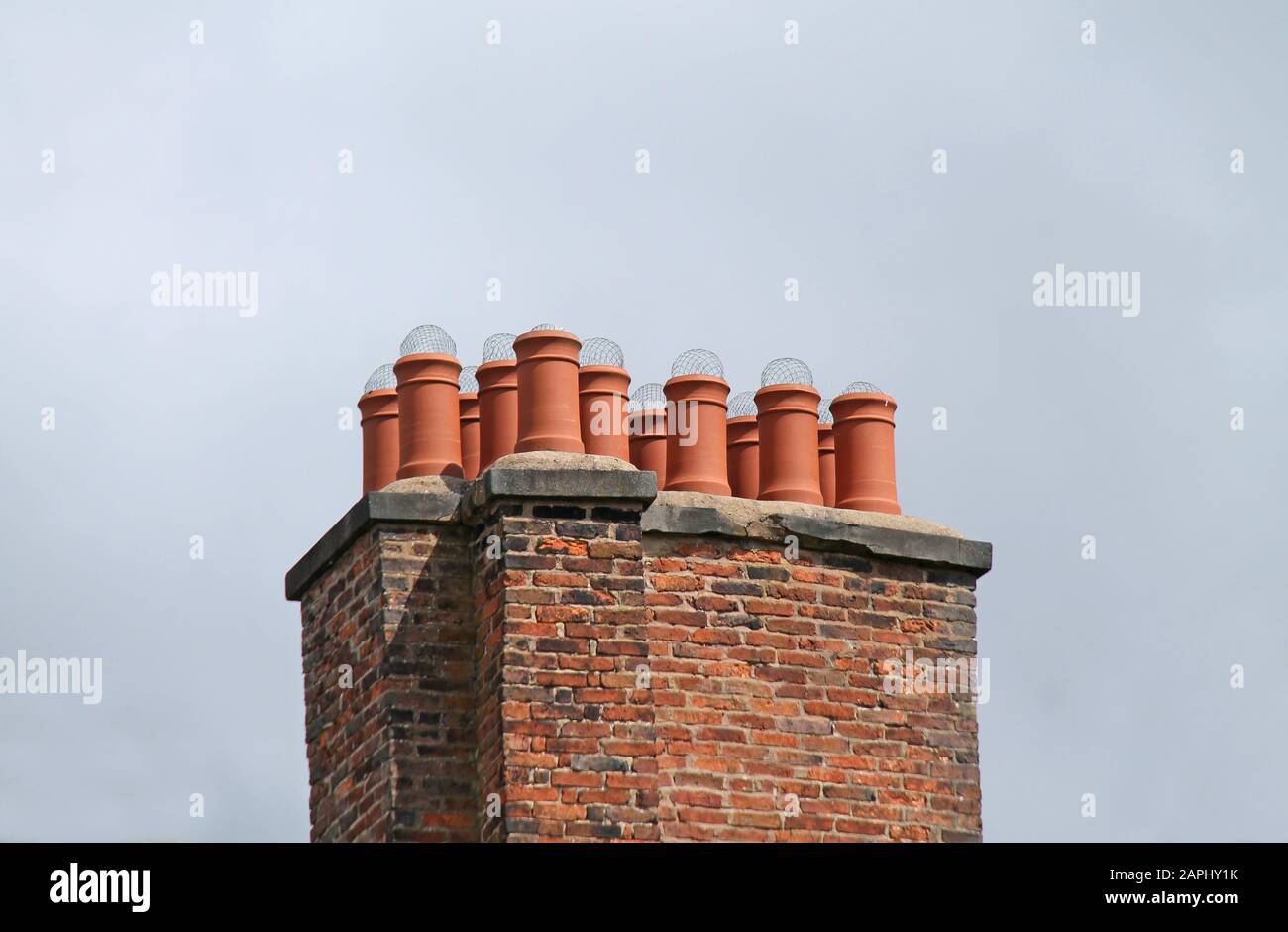 Terracotta Chimney Pots on a Large Brick Chimney Stock Photo - Alamy