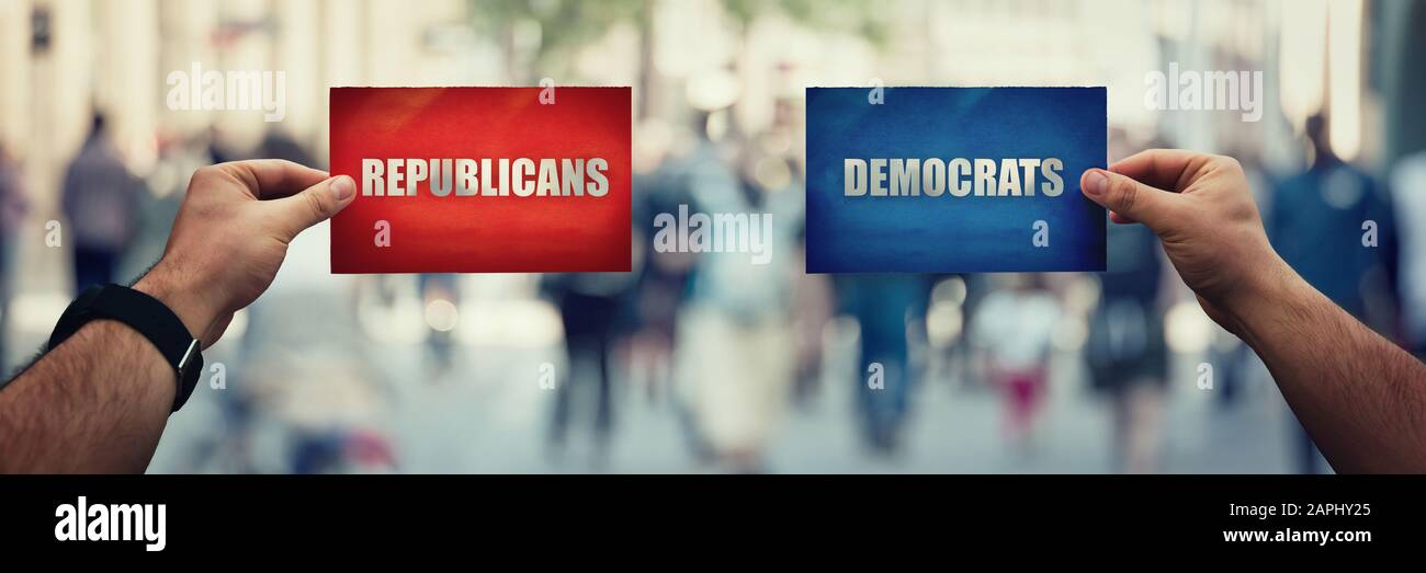 Two hands holding different colored paper sheet as Republicans versus ...