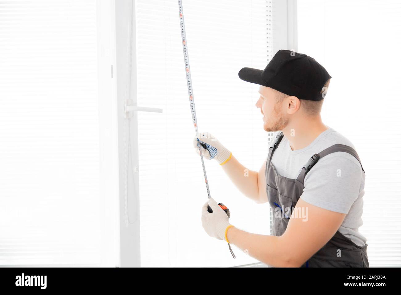 Master worker measures upvc window with ruler, installation process ...