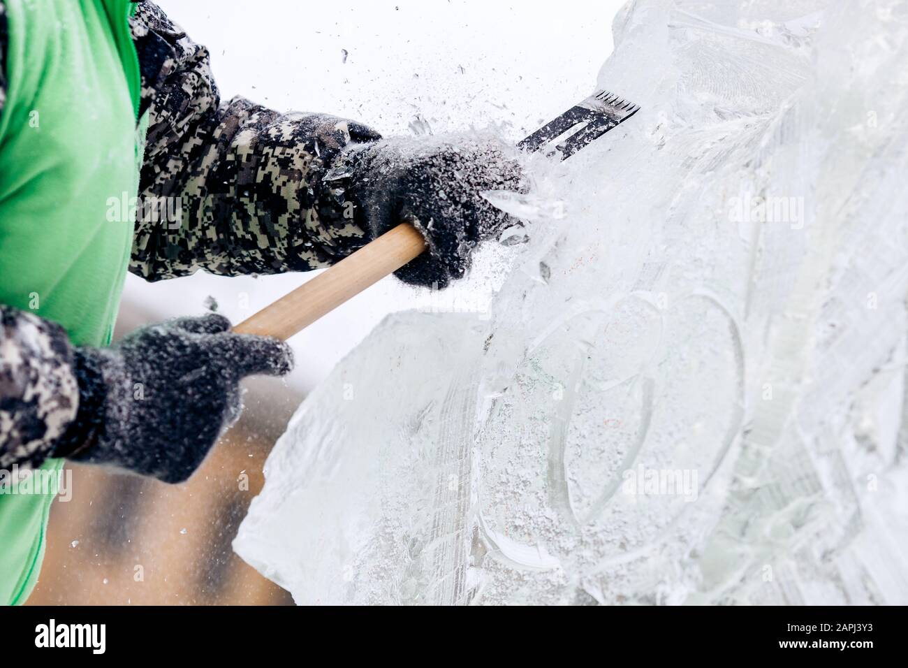 Ice sculpture carving man use chisel cut frozen winter Stock Photo - Alamy