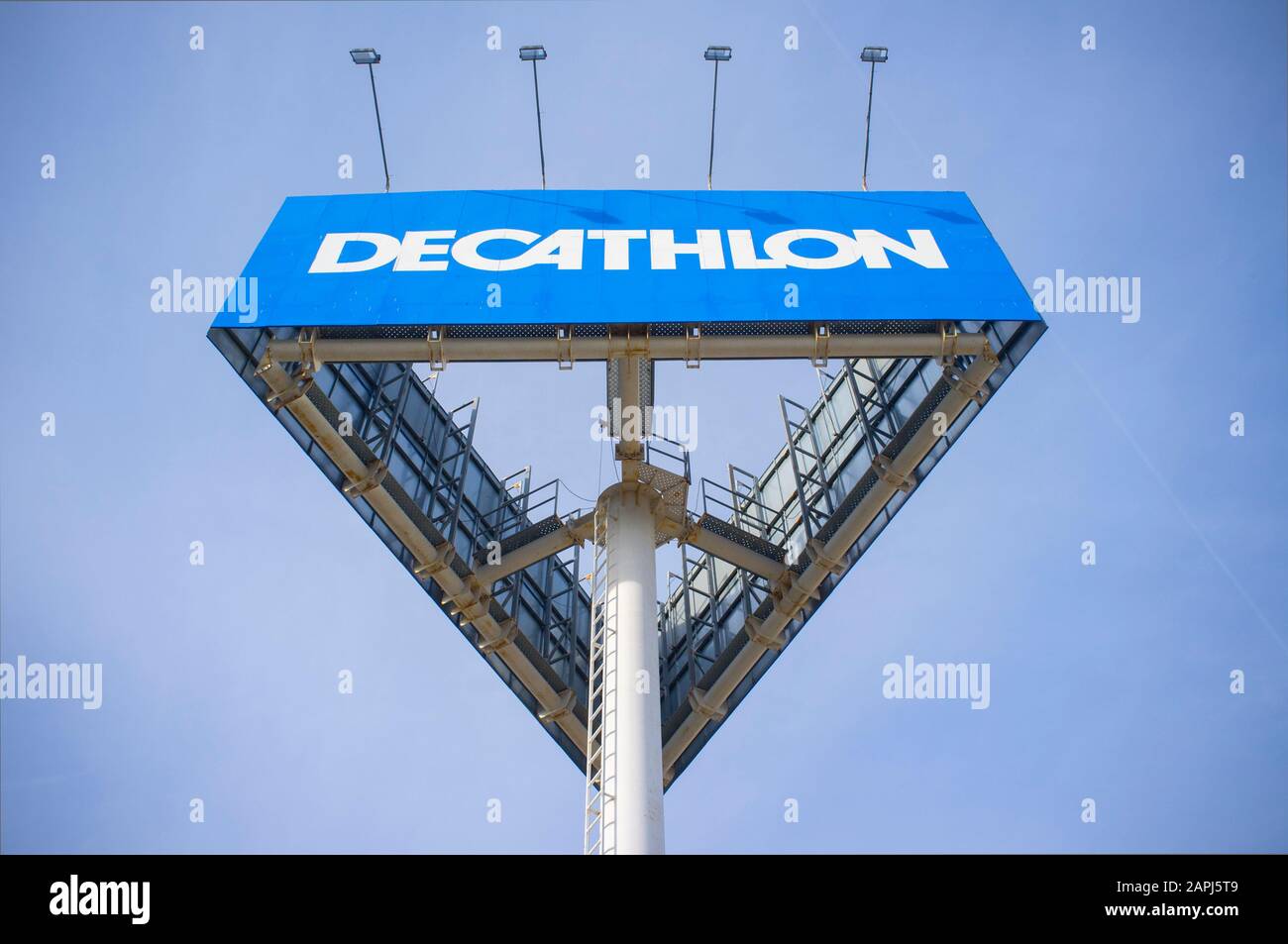 Decathlon sign pole over blue sky. Brand more than 1500 sporting goods ...