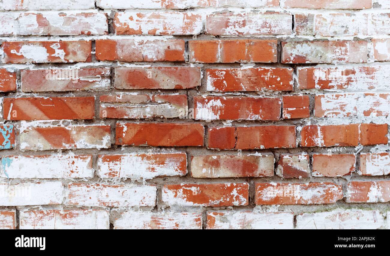 Rustic red brick background with white paint Stock Photo - Alamy
