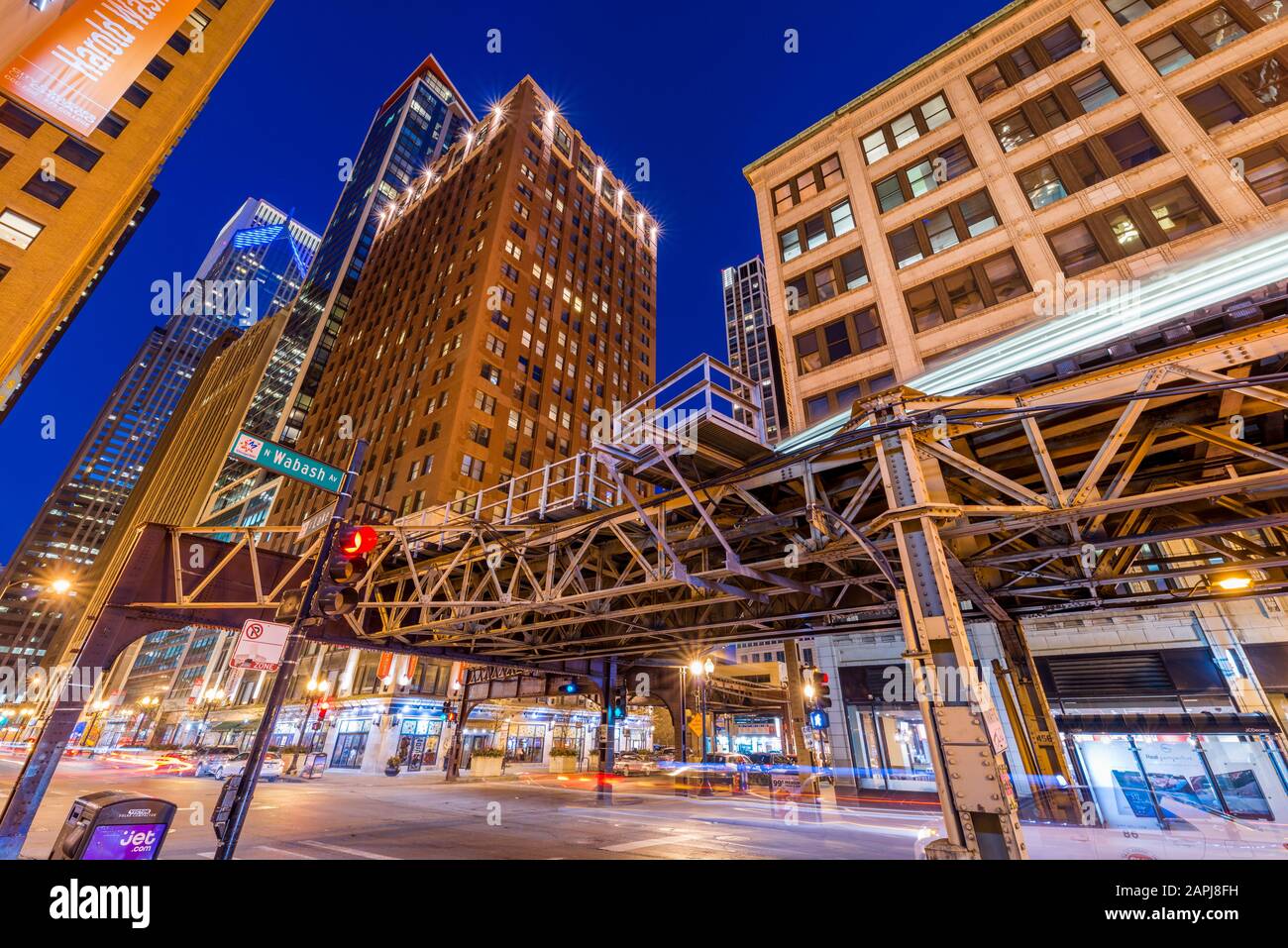 Chicago - March 2017, IL, USA: Downtown Chicago at night. Metro train ...
