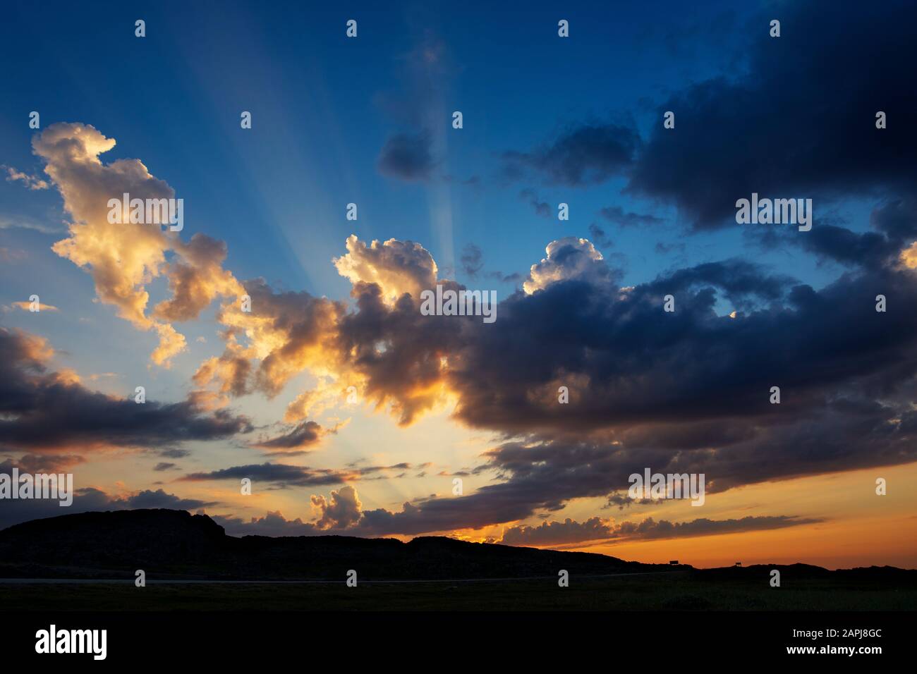 Sunset with sun rays, summer night in Northern Norway Stock Photo - Alamy