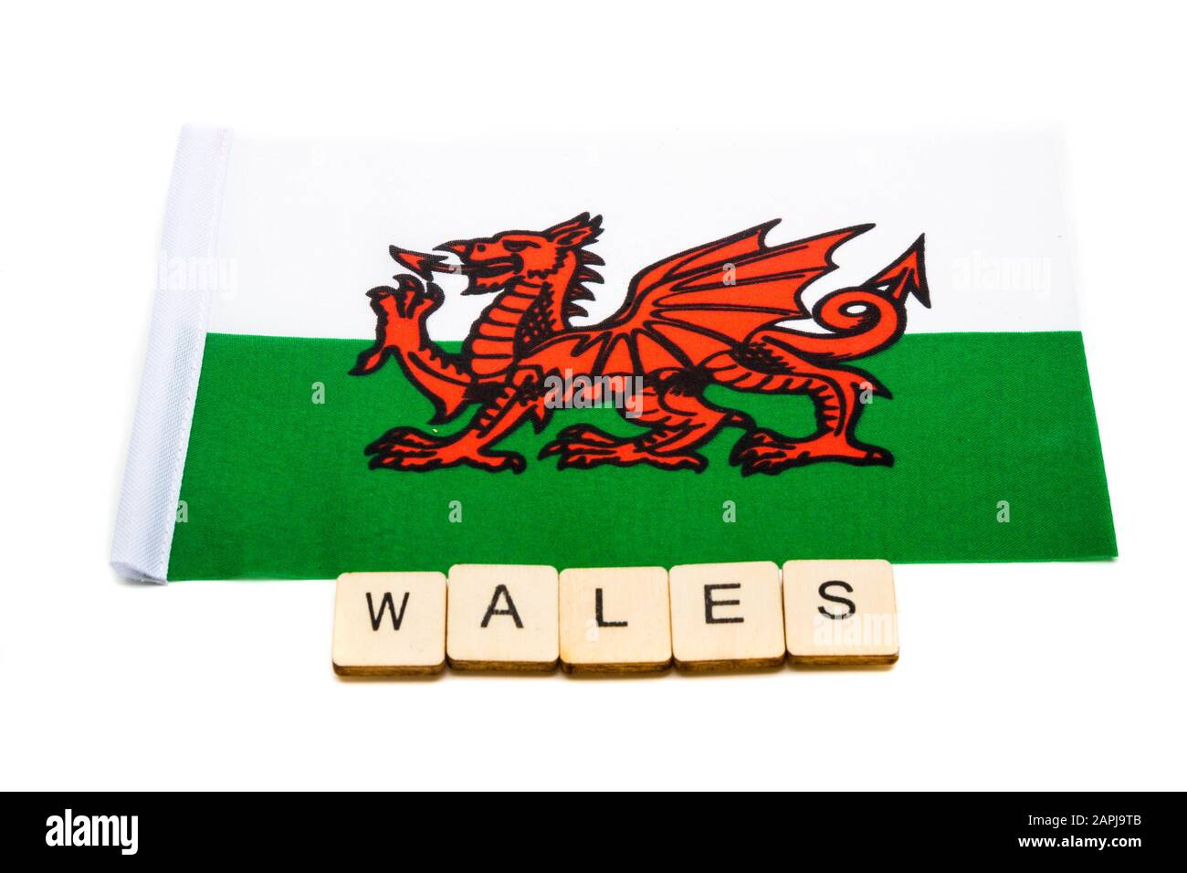 The national flag of Wales on a white background with a sign reading ...