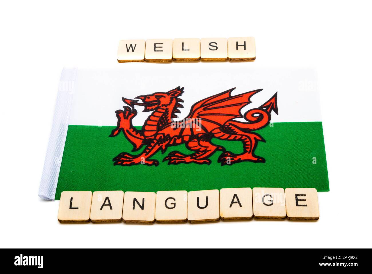 The national flag of Wales on a white background with a sign reading ...