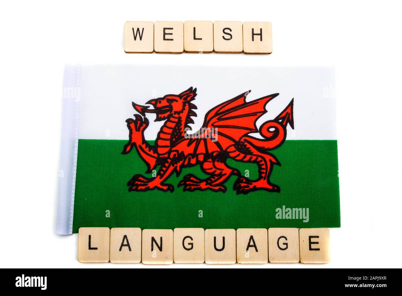 The national flag of Wales on a white background with a sign reading ...