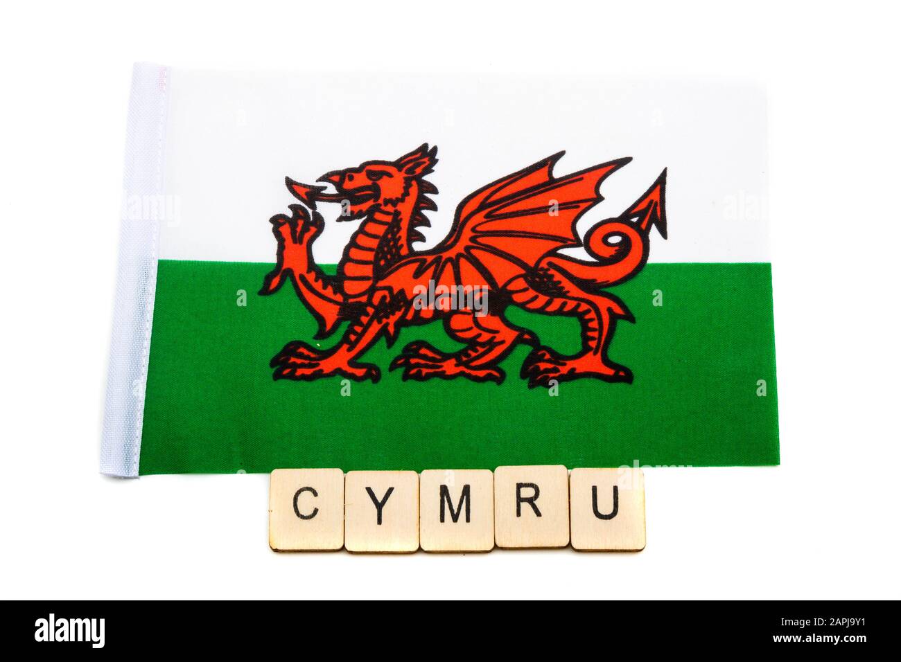 The national flag of Wales on a white background with a sign reading ...