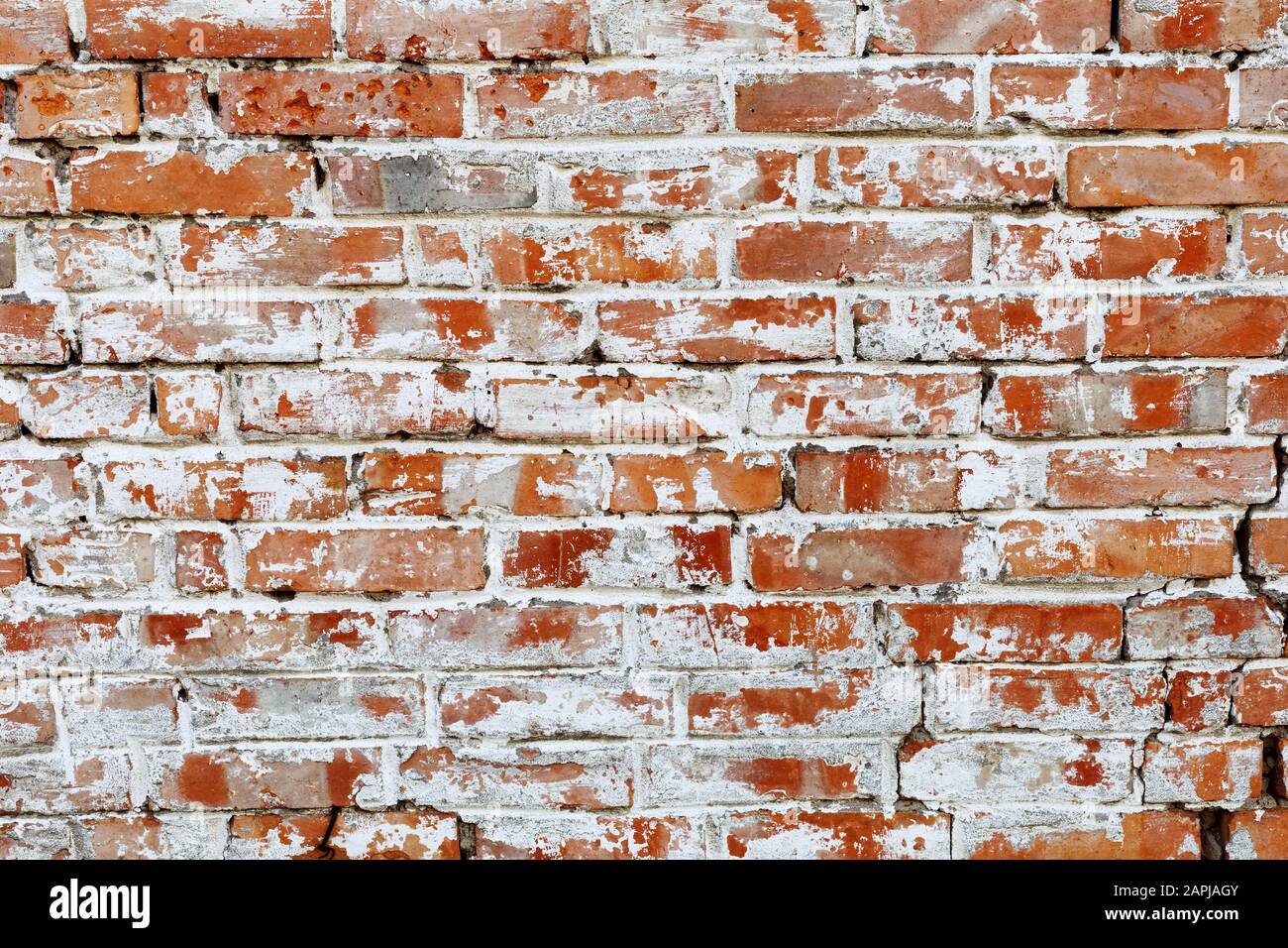 Rustic red brick background with white paint Stock Photo - Alamy