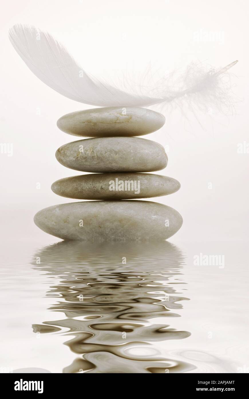 zen garden with stone pyramid and above a swan's feather Stock Photo ...