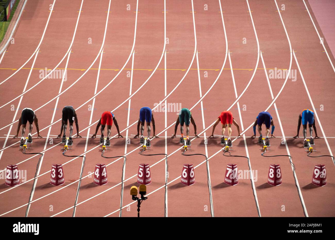 Feature, start, runner in the starting blocks, action, preliminary ...