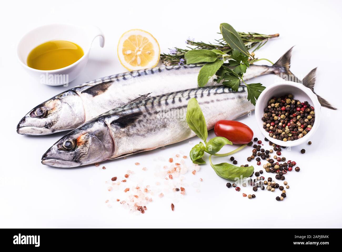 fresh sea fish to cook with ingredients on a white background Stock ...