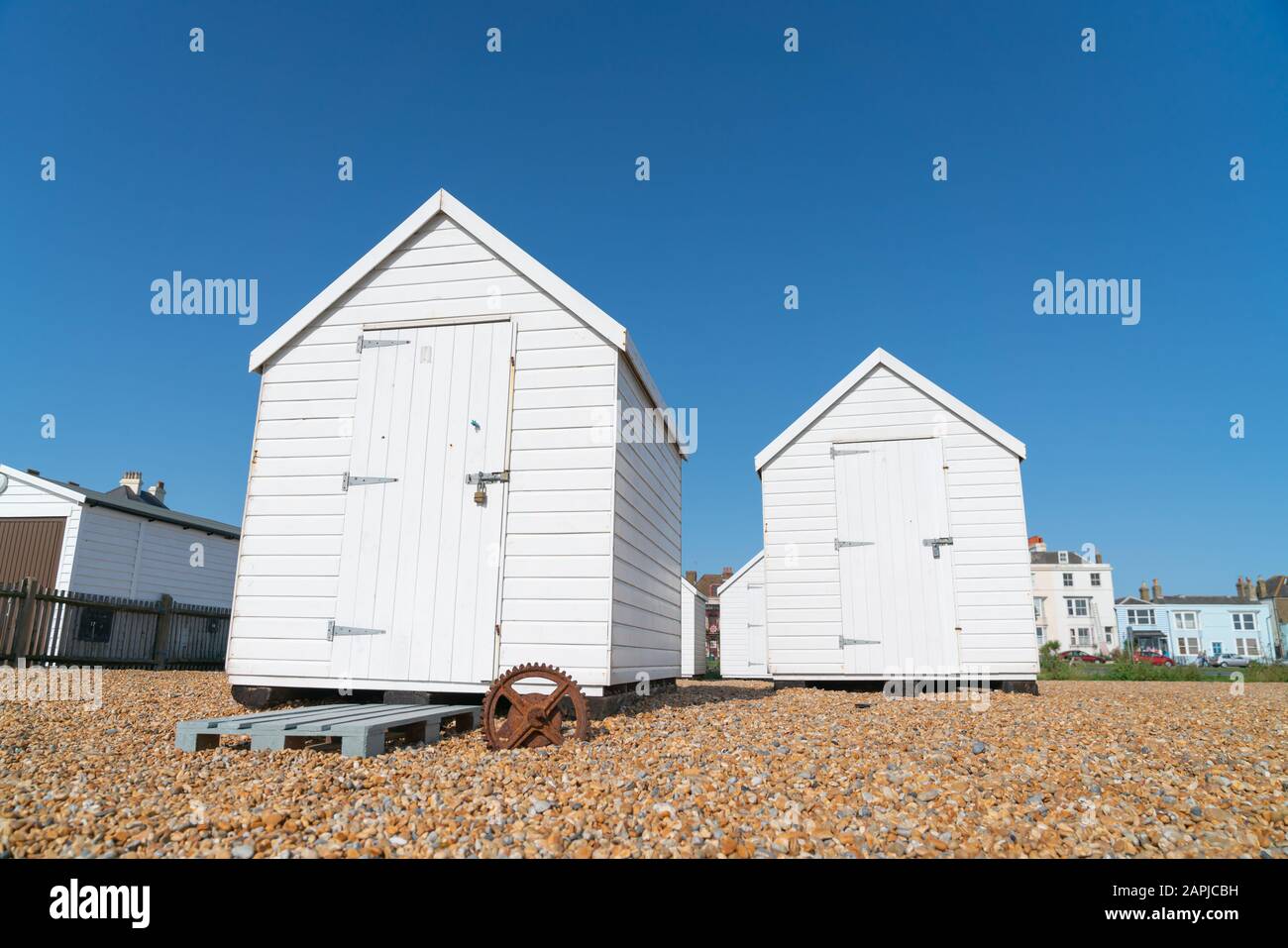Two white beach sheds on Deal waterfront low point of view Stock Photo ...