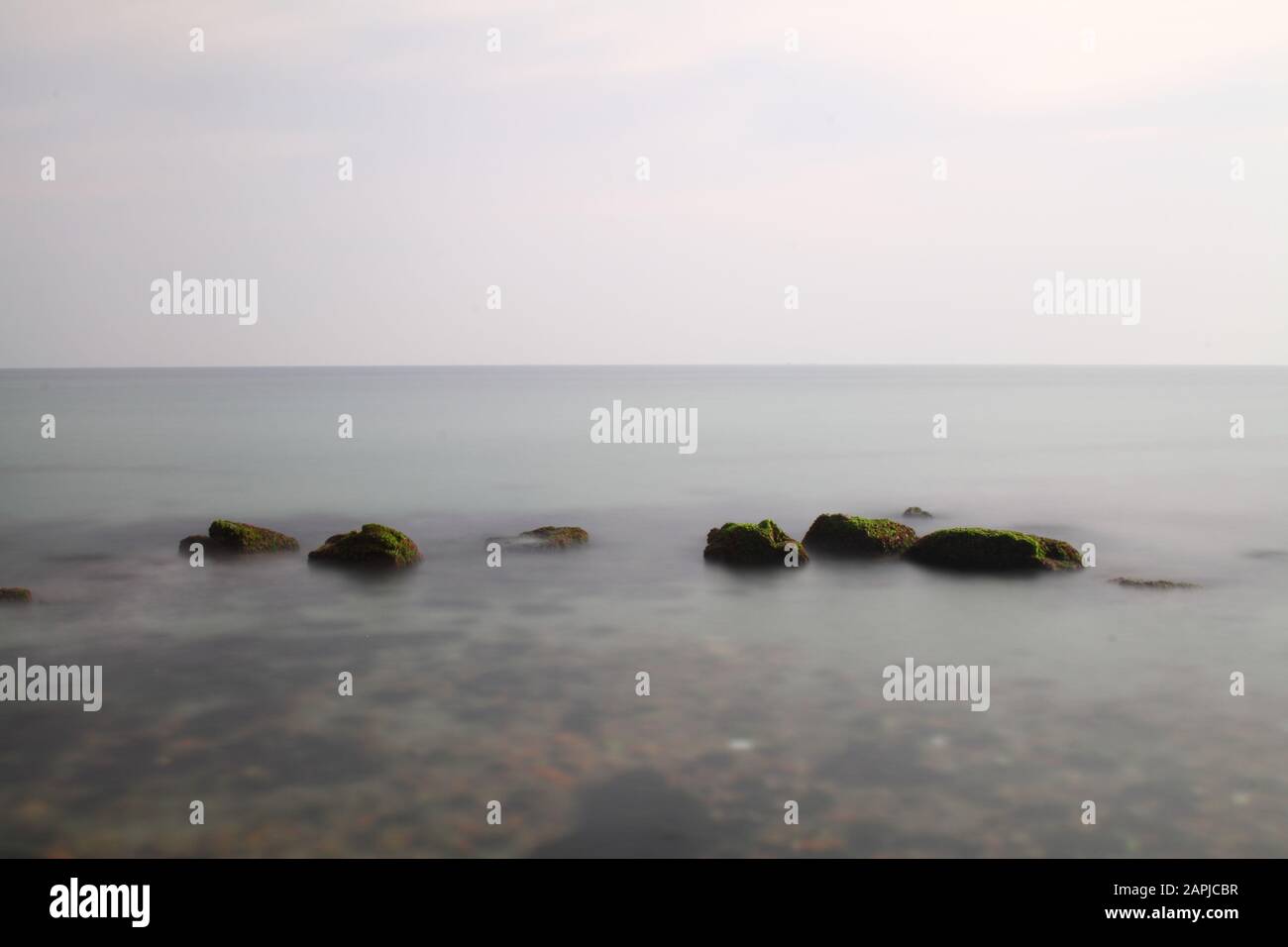 Sea waves breaking on a rocks. Deep blue sea waves hit cliff, hit rocks ...