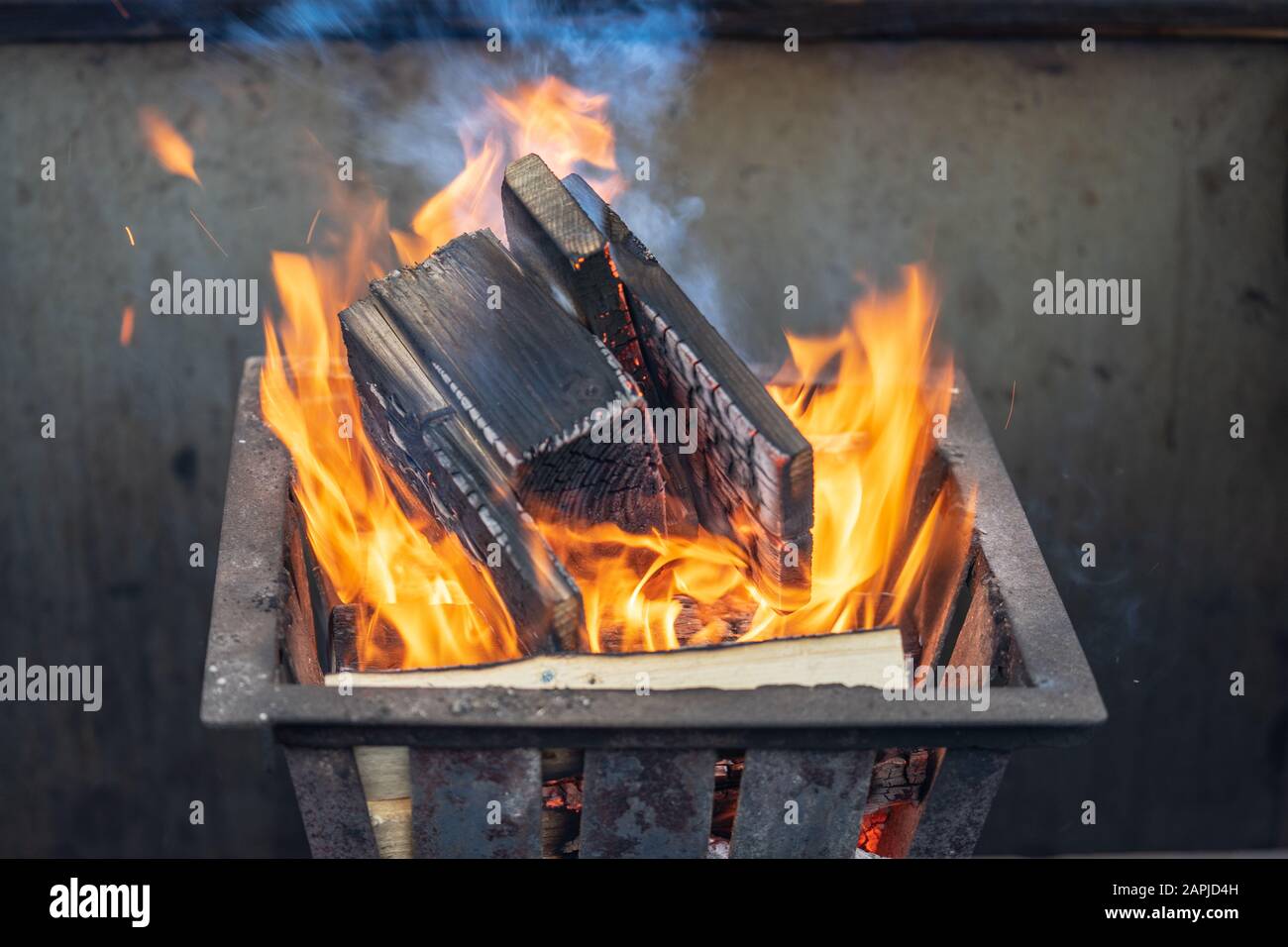 Rustic Metal Fire Basket.Burning Fire Basket Stock Photo - Alamy