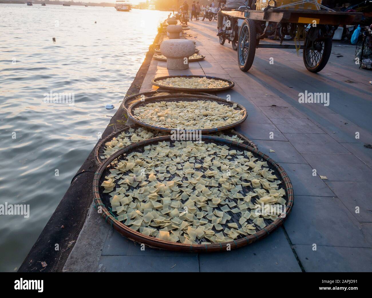 Cao Lau Noodle drying in sun on the riverside in Hoi An Ancient Town ...
