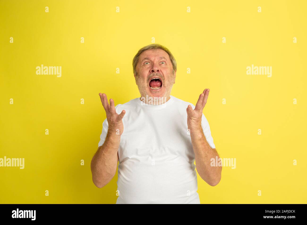 Astonished, shocked, wondered screams. Caucasian man portrait isolated ...