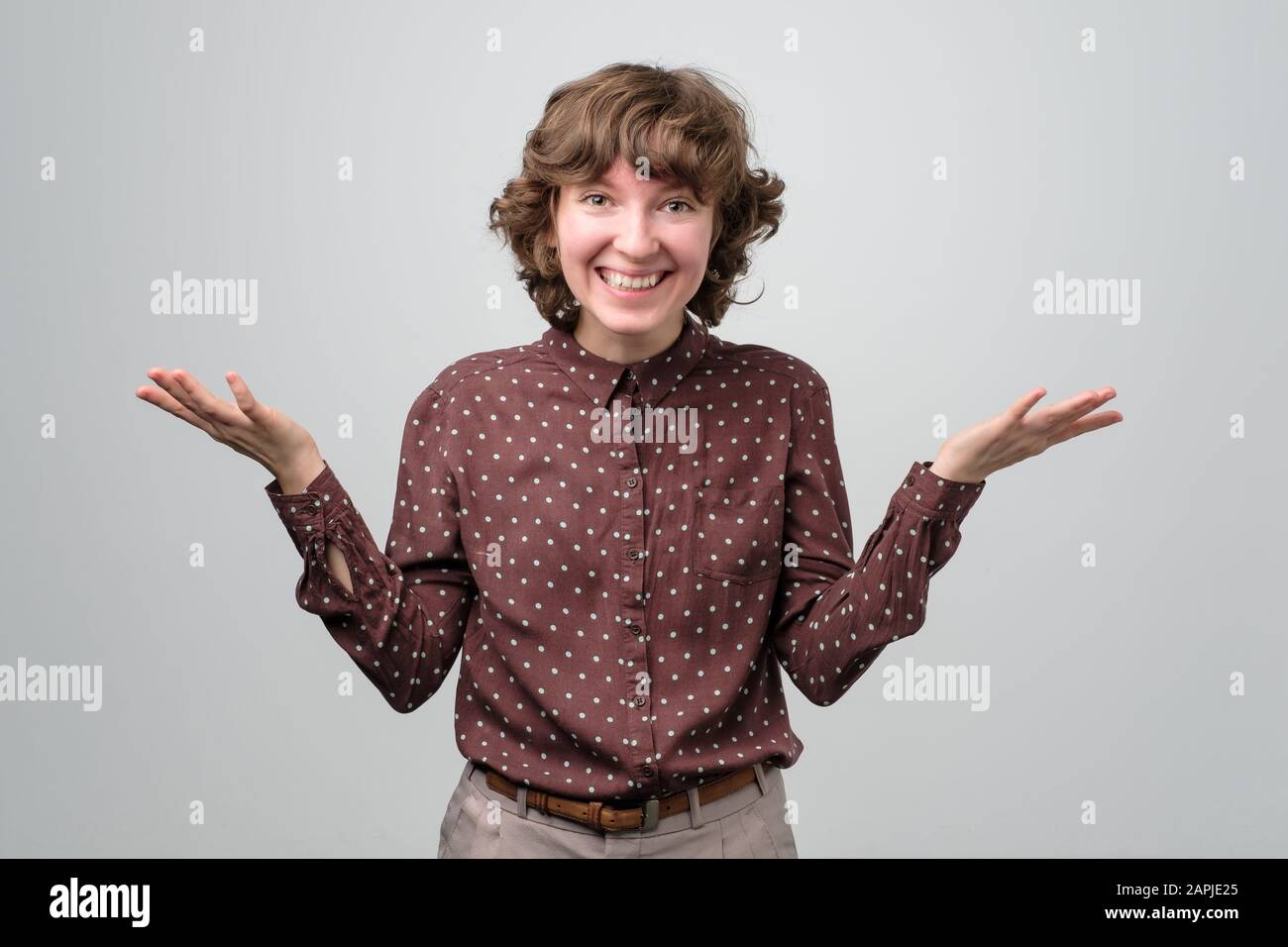 Shrugging pose hi-res stock photography and images - Alamy
