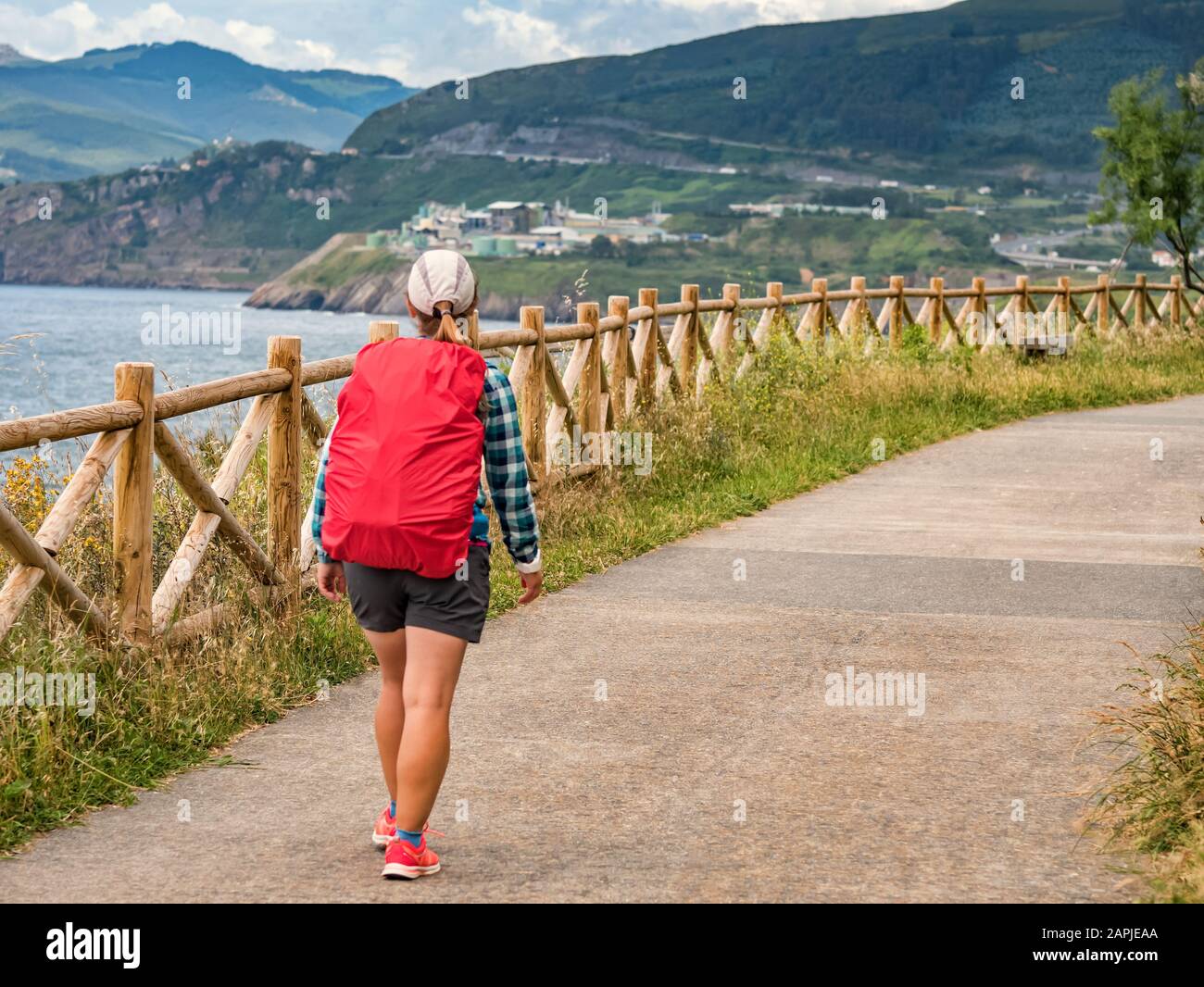 Lonely Pilgrim with backpack walking the Camino de Santiago in Spain ...