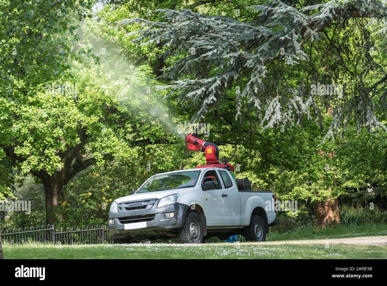 A truck bed mounted heavy duty sprayer propels a selective pesticide ...