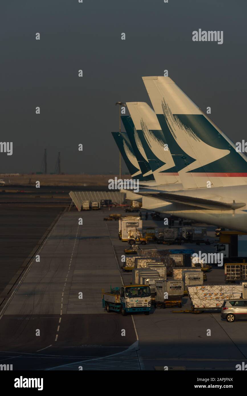 Tail of Cathay Pacific planes waiting at gate of Hong Kong ...