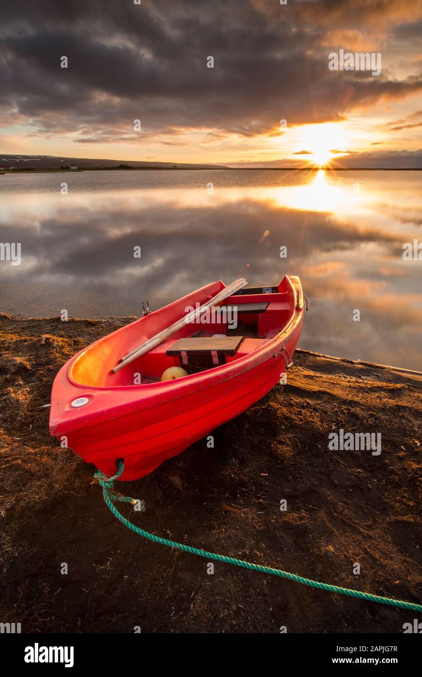 Red boat by the lake. Iceland Stock Photo - Alamy