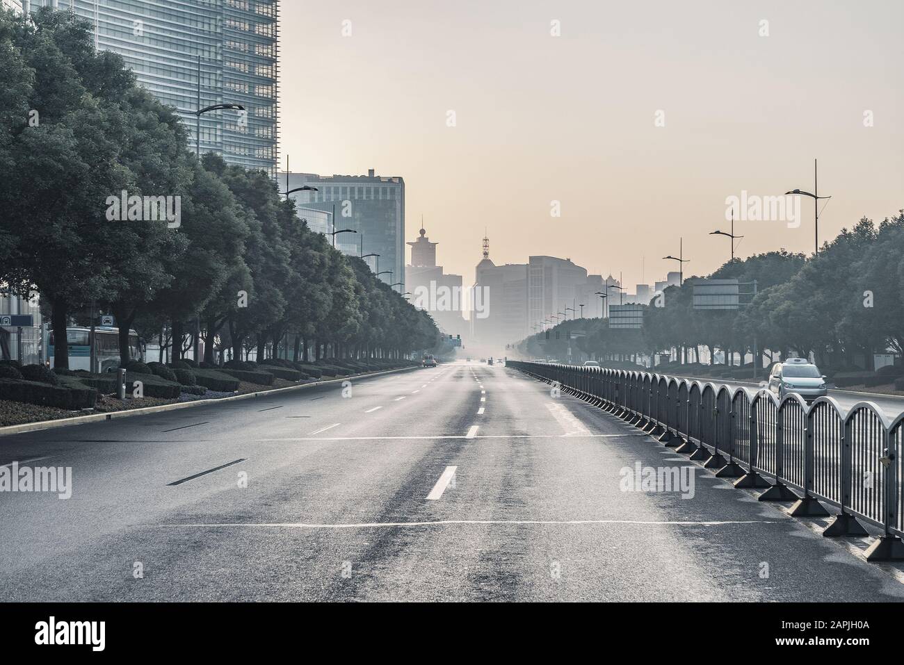 Long morning street in Shanghai city in the morning. China Stock Photo ...