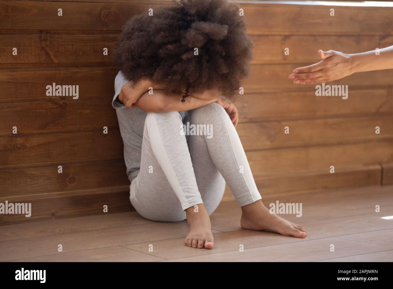 Woman holds out her hand to crying abandoned african child Stock Photo ...