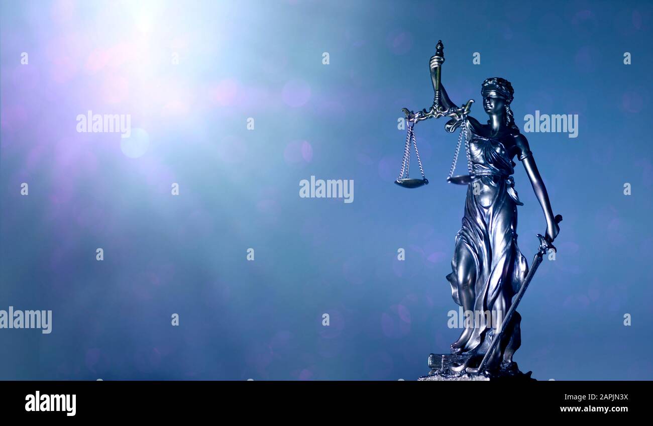 lady justice or justitia - blindfolded figurine holding balance scales ...