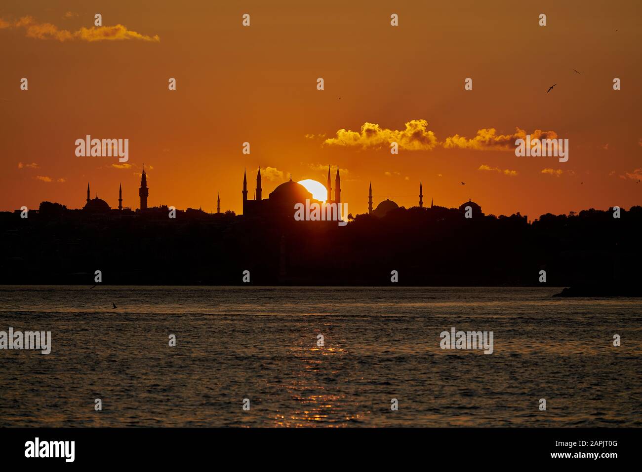 Beautiful sunset in Istanbul, Turkey. Sun is above silhouettes of Hagia ...