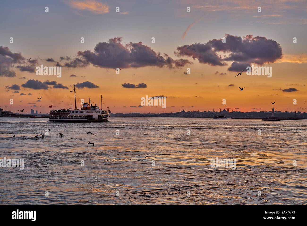 Beautiful sunset in Istanbul, Turkey. Sun is above silhouettes of Hagia ...