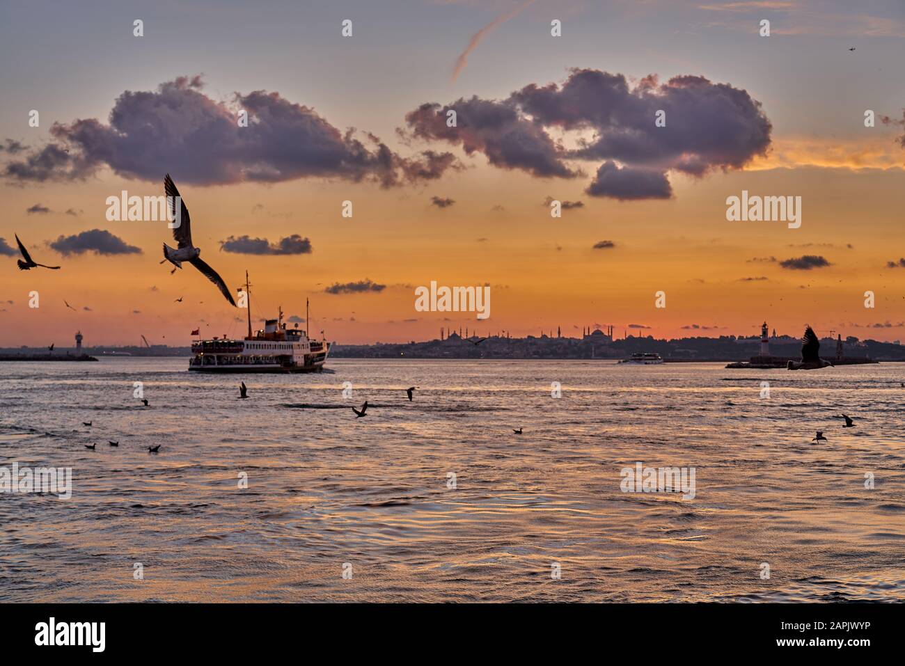 Beautiful sunset in Istanbul, Turkey. Sun is above silhouettes of Hagia ...