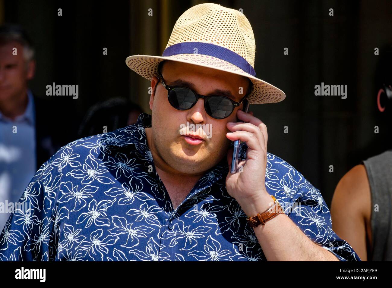 London street: white male, mobile phone, hat, sunglasses Stock Photo ...