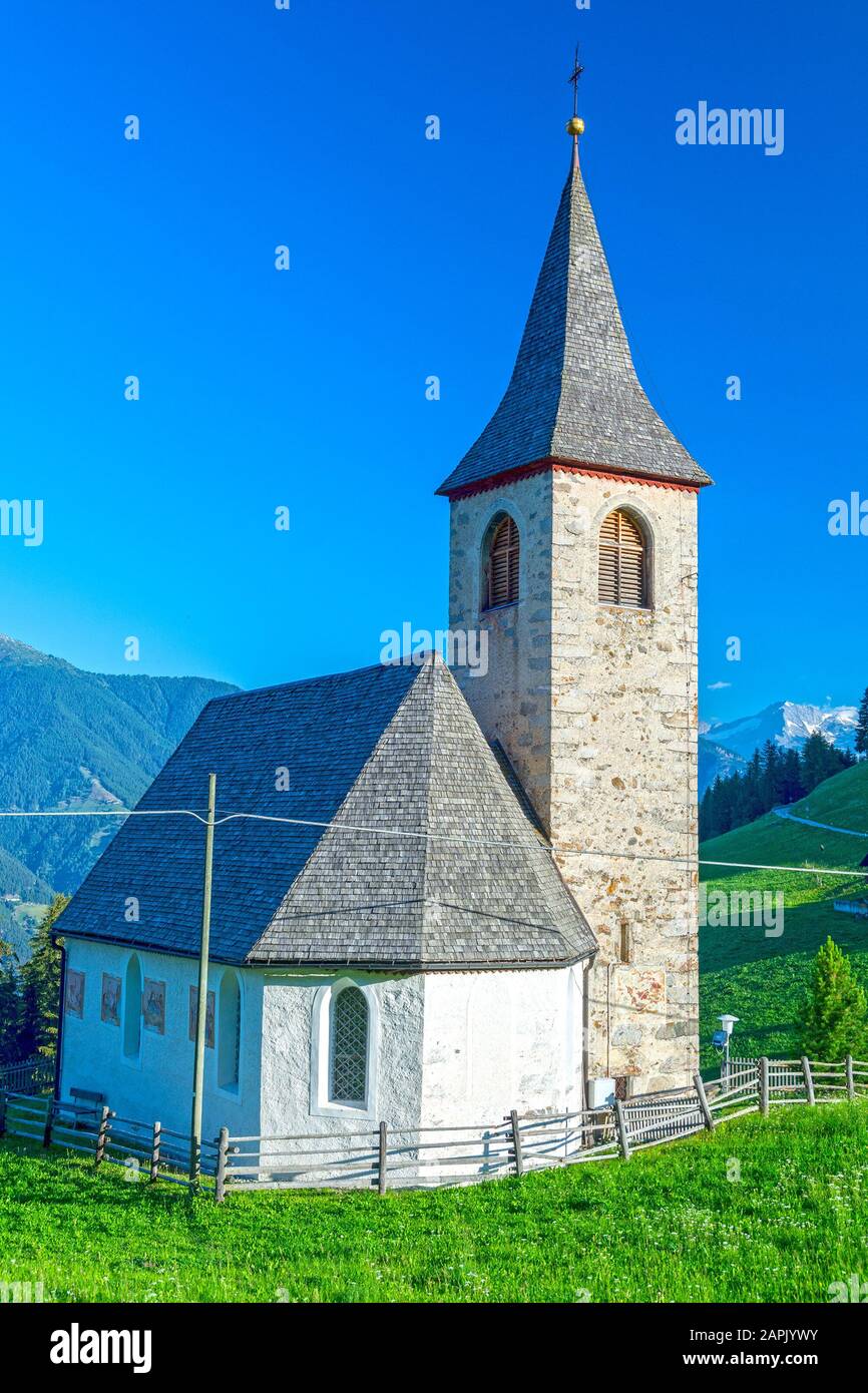 Small church in alpine village, Alps Mountain range in Italy ...