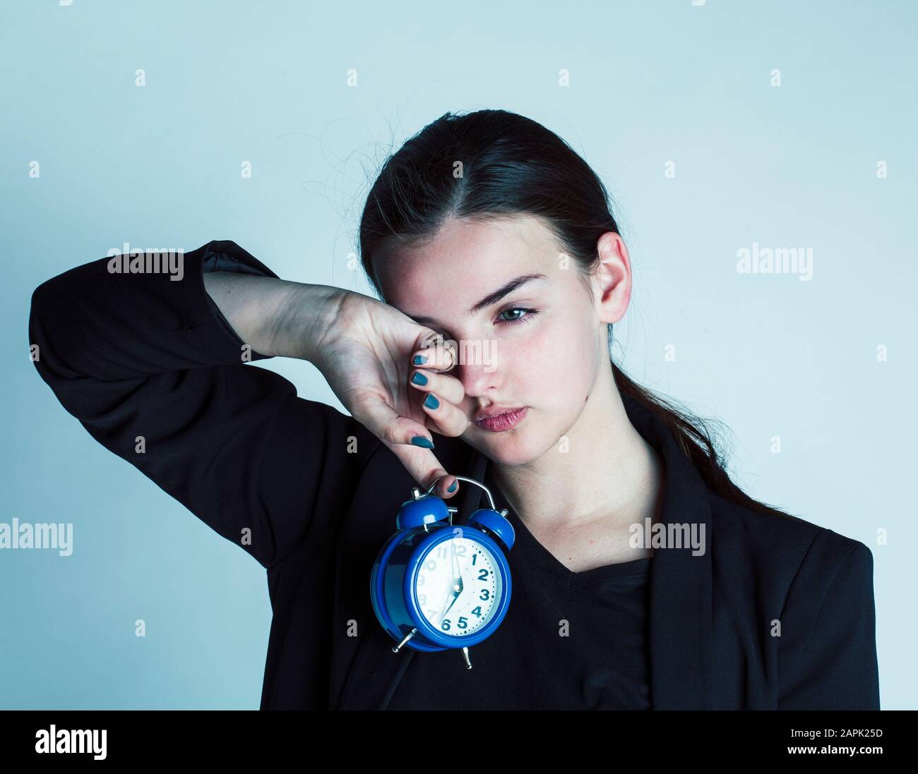 young beauty woman in business style costume waking up for work early ...