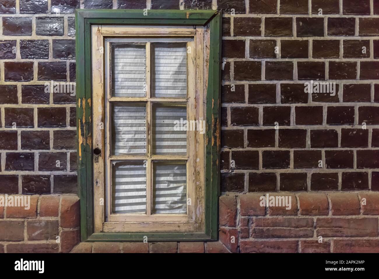 Old box window with a green frame and a tiled facade Stock Photo - Alamy
