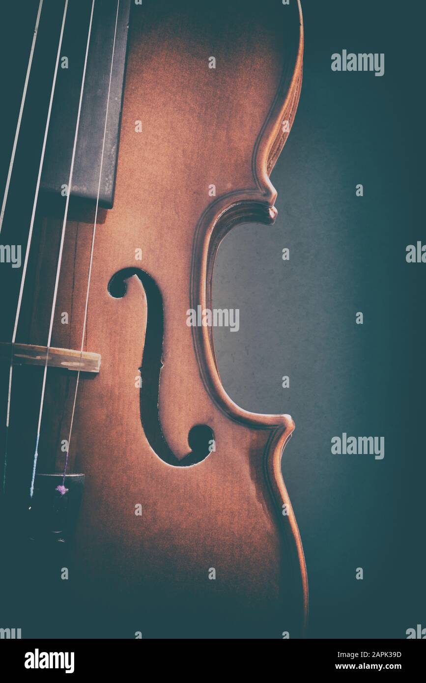 Violin detail with isolated black background vintage. Front view ...