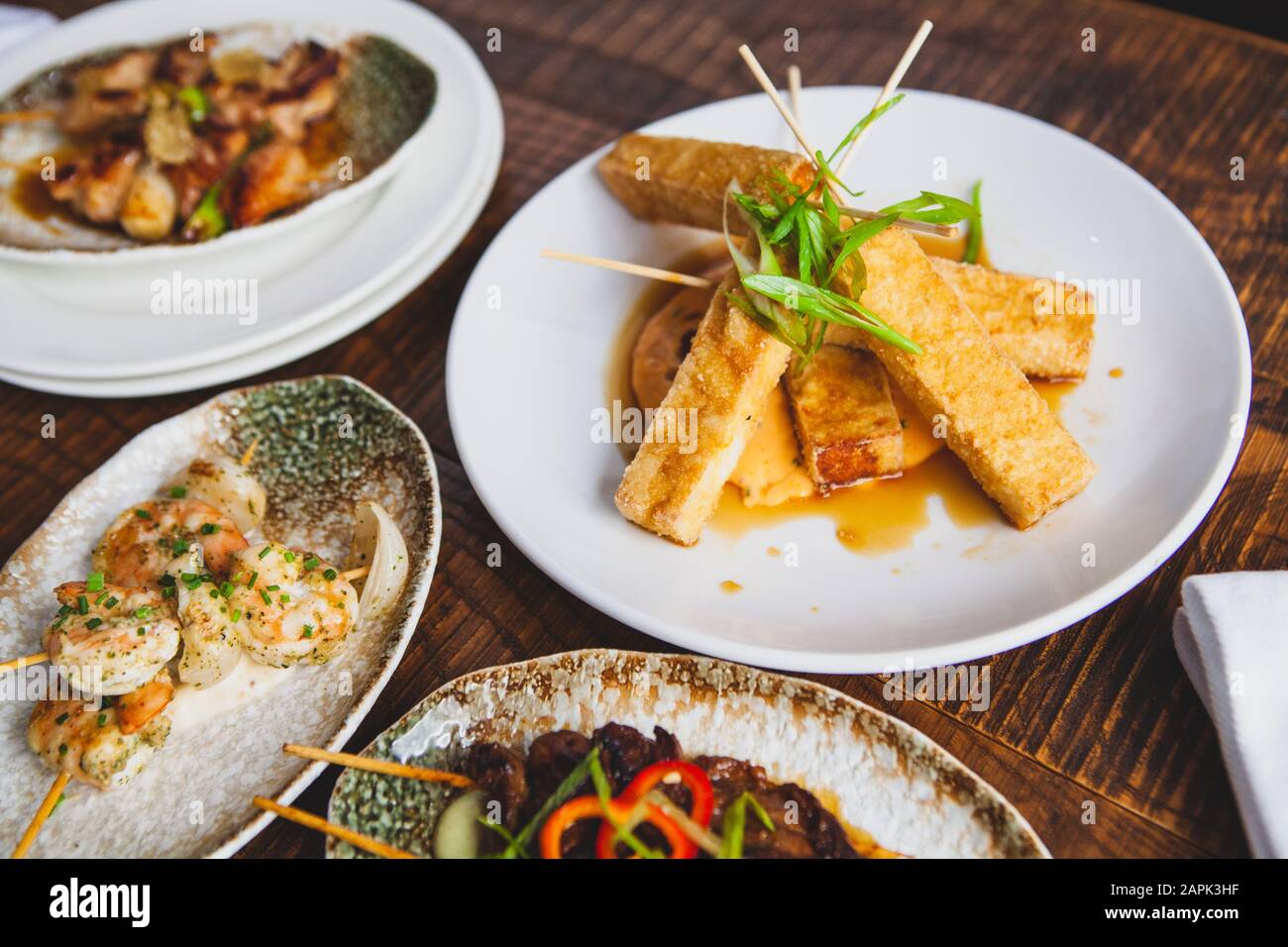Table setting of different skewered appetizers Stock Photo - Alamy
