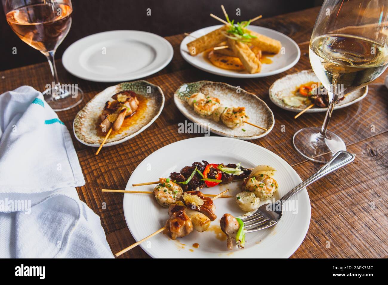 Table setting of different skewered appetizers Stock Photo - Alamy