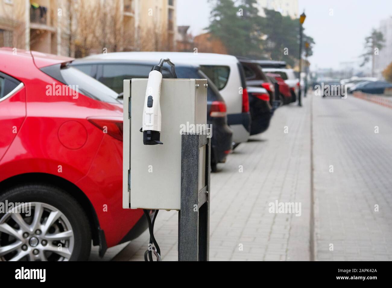 Electric vehicle charger station installed in parking lot in ...