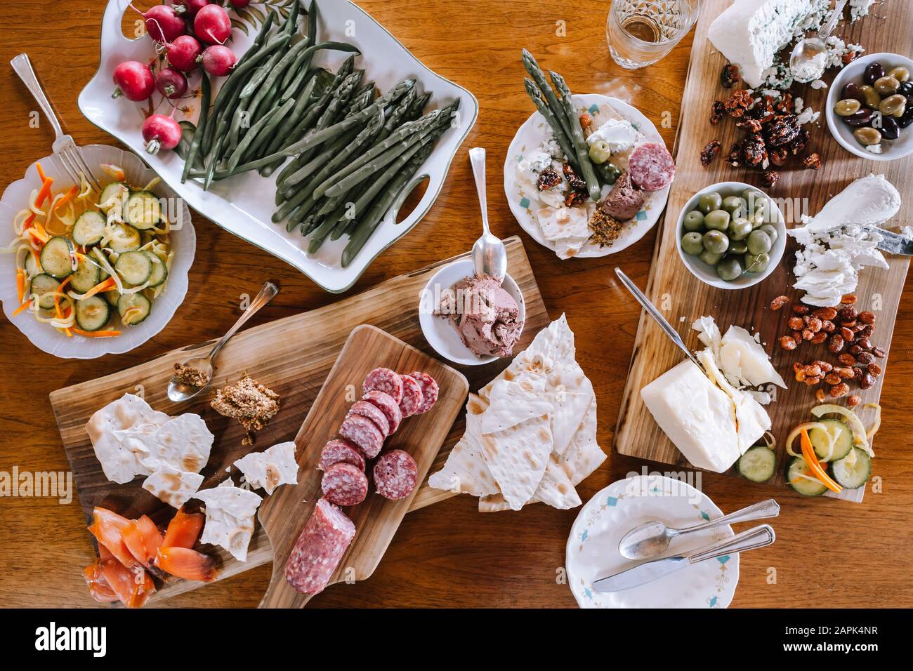 Spread of appetizers on wooden cutting boards and table Stock Photo - Alamy