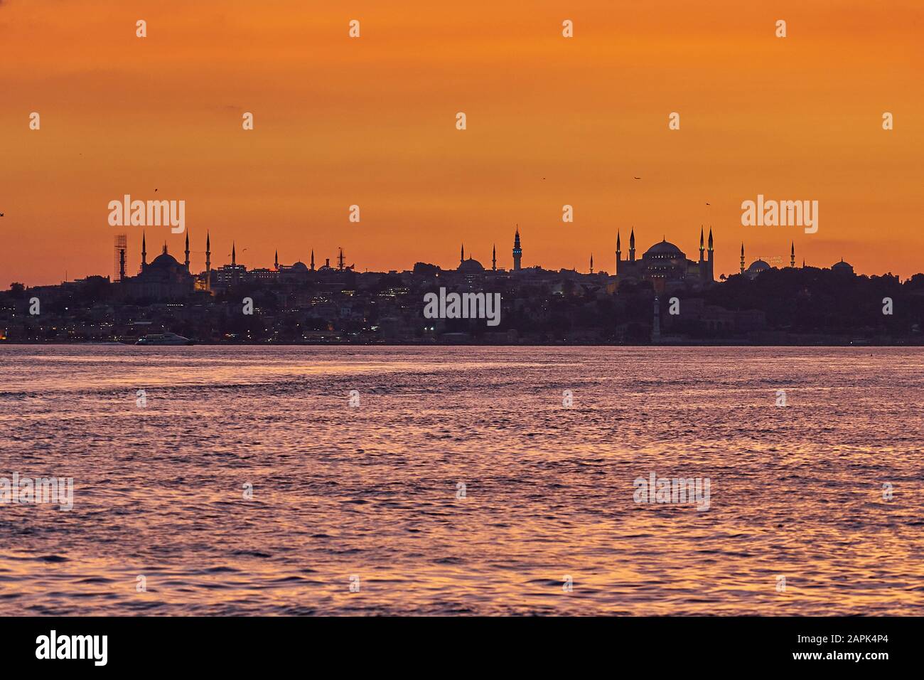 Beautiful sunset in Istanbul, Turkey. Sun is above silhouettes of Hagia ...
