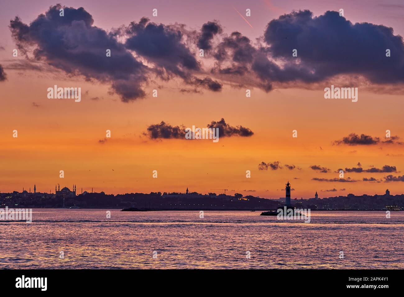 Beautiful sunset in Istanbul, Turkey. Sun is above silhouettes of Hagia ...