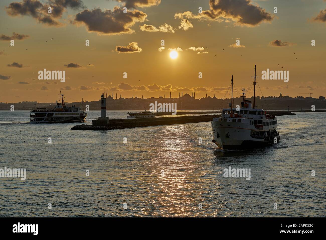 Beautiful sunset in Istanbul, Turkey. Sun is above silhouettes of Hagia ...